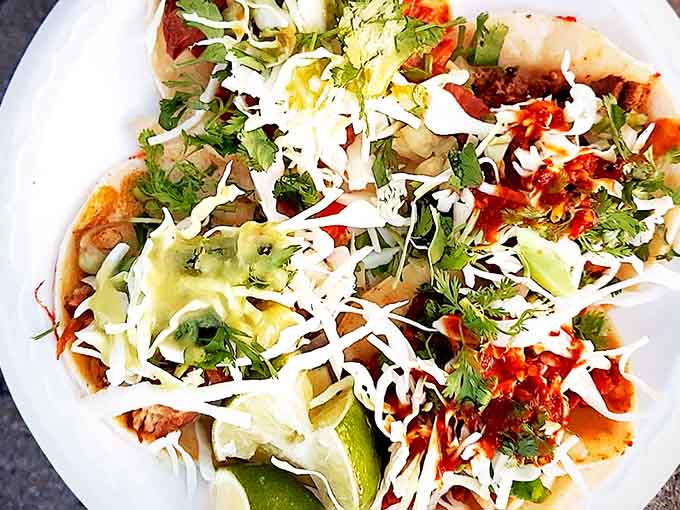 Behold the holy grail of street food economics: authentic Mexican tacos at prices that feel like a time machine to 1995.