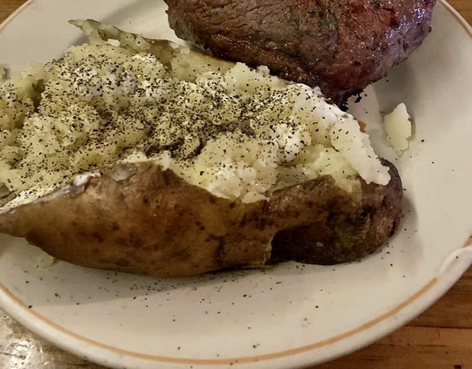 This isn't just a baked potato&mdash;it's a geological event on your plate, butter melting into its fluffy interior like a warm spring day.