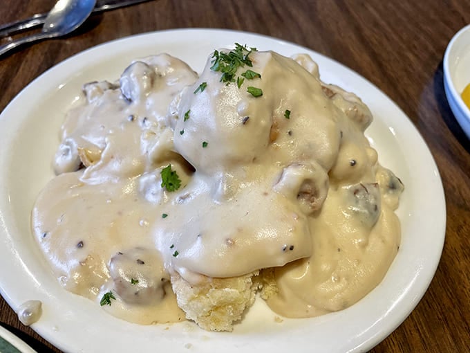 Biscuits drowning happily in creamy gravy&mdash;proof that sometimes the most photogenic foods are the most delicious.