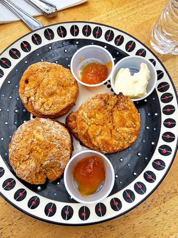 Sweet potato biscuits that could make a Southern grandmother weep with joy. Golden-orange pillows of perfection served with honey that's basically liquid sunshine.
