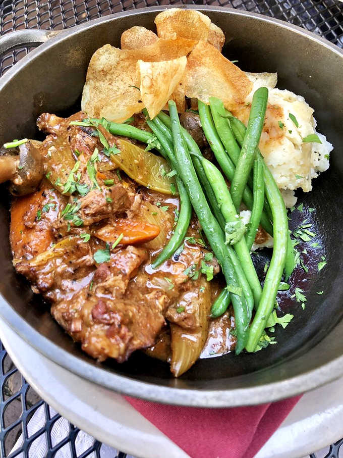 This isn't just beef bourguignon; it's a slow-simmered love letter to French countryside cooking that comes with its own edible exclamation points.