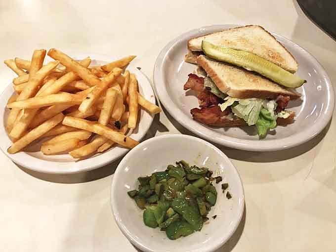 The legendary breakfast sandwich arrives with crispy bacon peeking out, a monument to morning perfection that keeps hunger at bay.