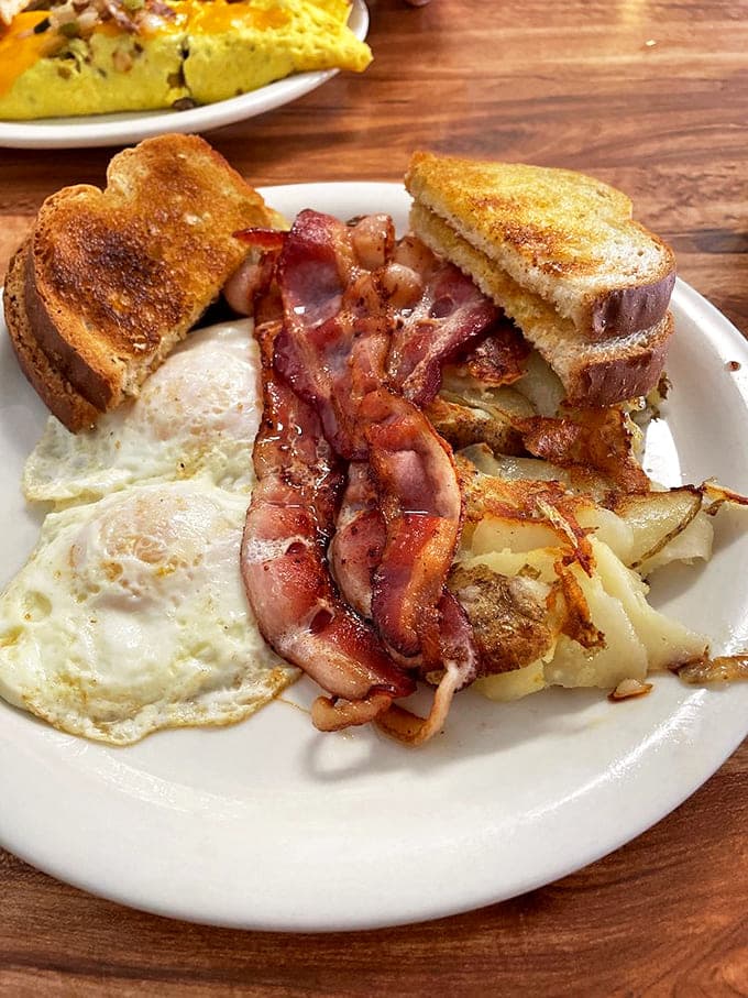 Breakfast nirvana: perfectly cooked eggs, bacon with that ideal crisp-yet-chewy texture, and hash browns that could make a potato farmer weep with joy.