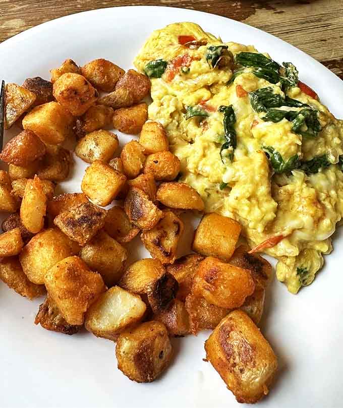 This omelet and home fries combo isn't just breakfast&mdash;it's edible therapy that costs less than a session with your therapist.