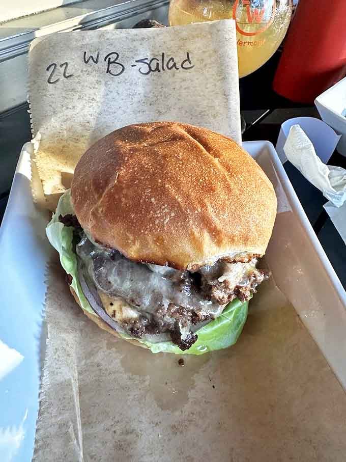 This isn't just a burger; it's a juicy masterpiece of local beef, melted cheese, and fresh greens that might just ruin all other burgers for you.