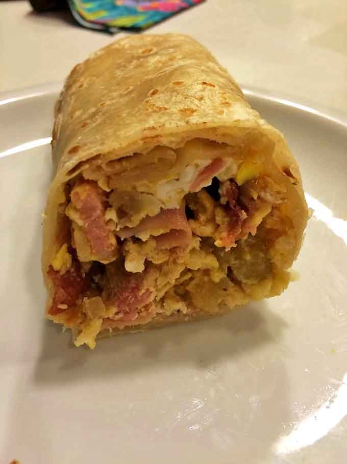 Breakfast perfection doesn't happen by accident. This burrito's cross-section reveals the architectural genius behind every bite&mdash;layers of flavor in perfect harmony.