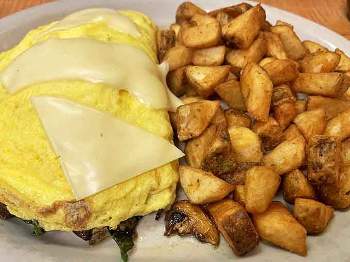This cheese-topped omelet with perfectly golden home fries is the breakfast equivalent of a warm hug on a cold Alaskan morning.