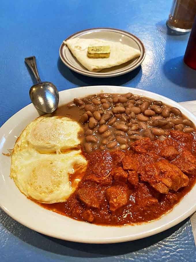 Carne Adovada that makes time stand still&mdash;tender pork swimming in red chile alongside perfectly fried eggs and pinto beans. The holy trinity of breakfast.