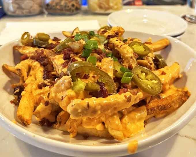Behold the loaded pimento cheese fries in all their glory&mdash;crispy potatoes smothered in creamy cheese, with jalape&ntilde;os and bacon playing supporting roles in this comfort food blockbuster.