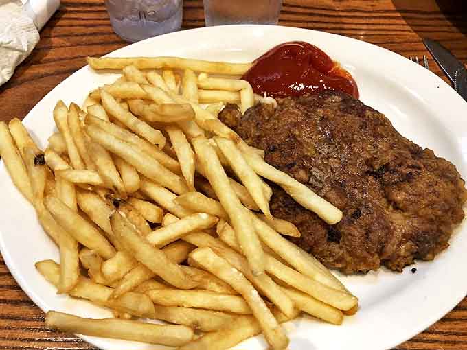 This chicken fried steak doesn't just satisfy hunger&mdash;it creates memories. Golden, crispy coating giving way to tender beef with fries standing at attention.