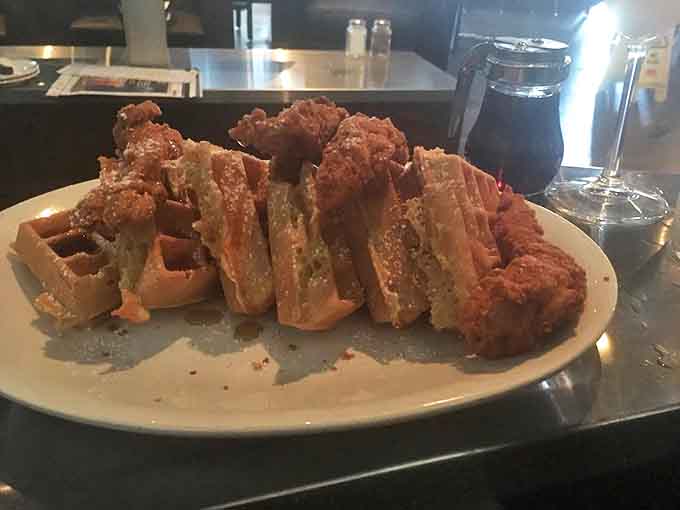 Golden-fried chicken perched atop Belgian waffles &ndash; a sweet and savory romance that would make Shakespeare write a sonnet.