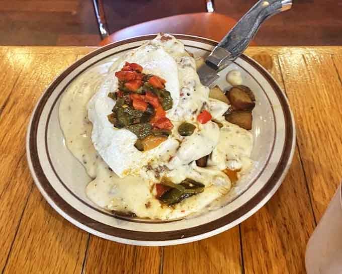This isn't just breakfast, it's a morning masterpiece. Smothered in country gravy with vegetables adding both color and conscience.