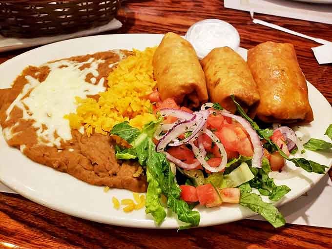These chimichangas aren't just fried, they're transformed &ndash; crispy golden perfection alongside beans, rice, and a salad that isn't just there for decoration.