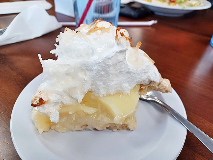 The legendary coconut cream pie in all its glory&mdash;that meringue defies both gravity and your willpower to resist.