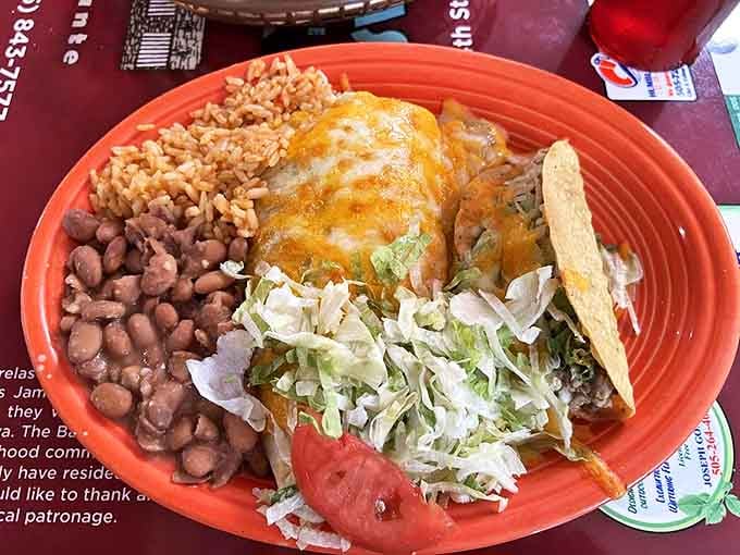 Not so much a plate as a flavor festival. Rice, beans, cheese-smothered enchiladas, and fresh veggies create the perfect New Mexican symphony.