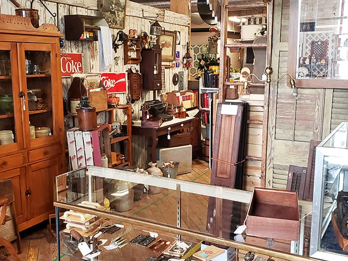 Vintage treasures await in shops like this one. Half the fun is imagining the stories behind each antique while planning where you'll stop for pie afterward.