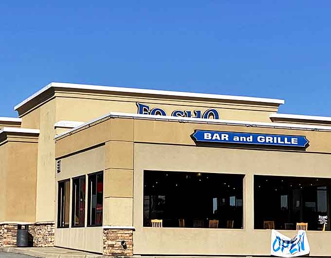 Fosho Bar and Grille beckons with its "OPEN" sign &ndash; the universal symbol for "your diet can start tomorrow."