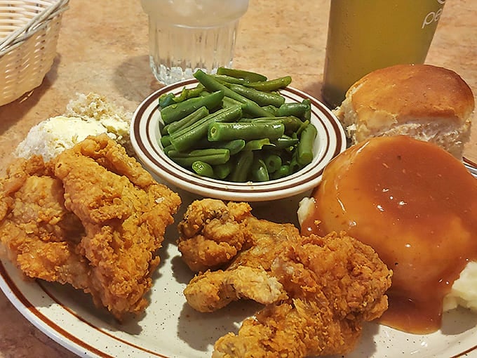 Golden-crisp fried chicken that would make Colonel Sanders question his life choices. Paired with green beans and mashed potatoes drowning in gravy &ndash; pure heartland bliss.