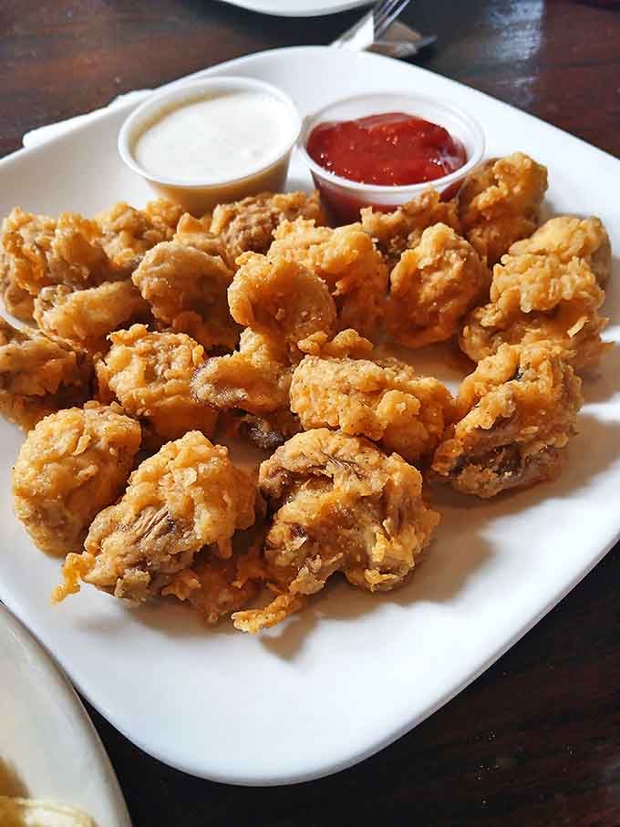 These golden-battered mushrooms aren't just fried – they're transformed. Crispy exterior giving way to juicy mushroom goodness that might just ruin all other appetizers for you.