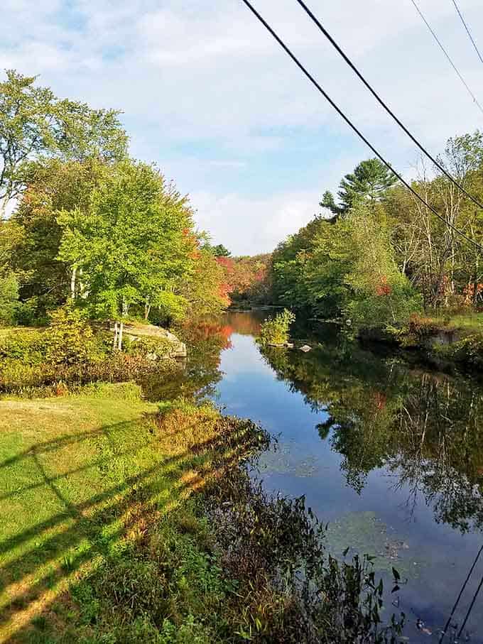 Nature's mirror: The Clear River reflects autumn's early brushstrokes, creating a double feature of New England's most celebrated season.