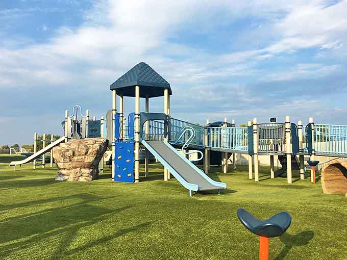 This playground isn't just for kids&mdash;it's a colorful oasis where parents can watch their children burn energy while fantasizing about sliding down that blue slide themselves.