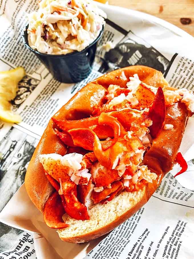 The star of the show in all its glory: chunks of sweet Maine lobster nestled in a perfectly toasted roll. Food doesn't get more honest than this.