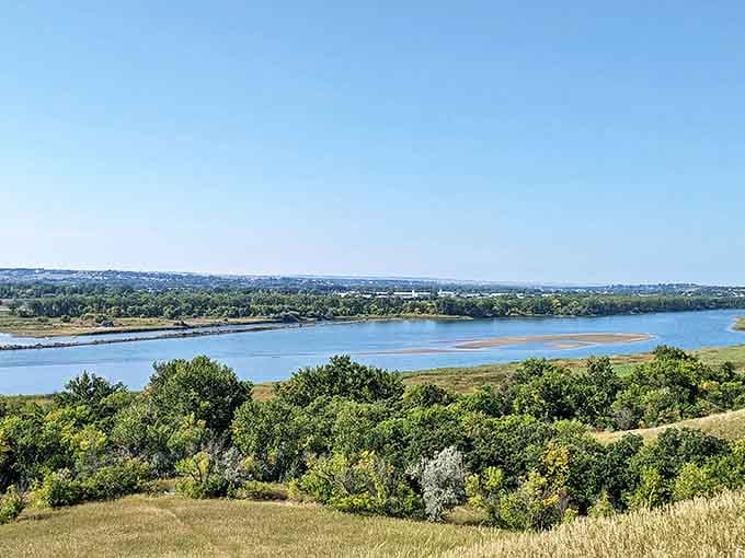 The Missouri River curves gracefully through Bismarck's landscape, a liquid highway that brought the first settlers and now brings kayakers and anglers.