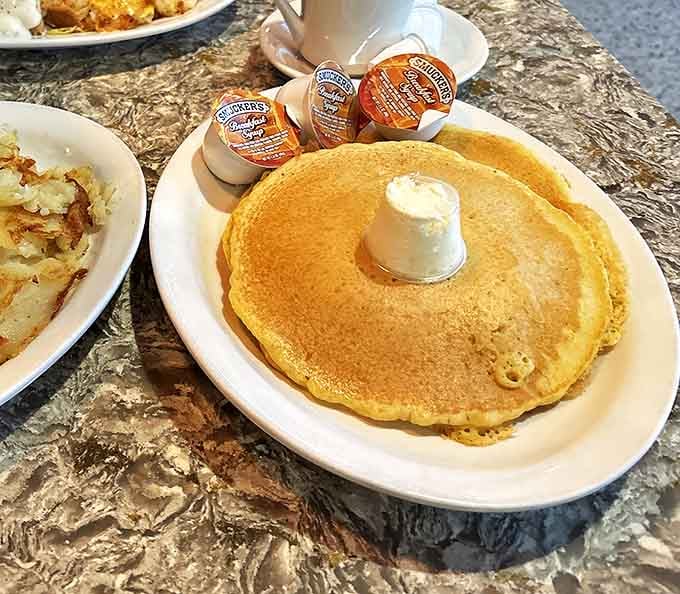 Golden pancakes that practically float off the plate. That perfect butter crown slowly melting into breakfast nirvana &ndash; worth setting the alarm for.