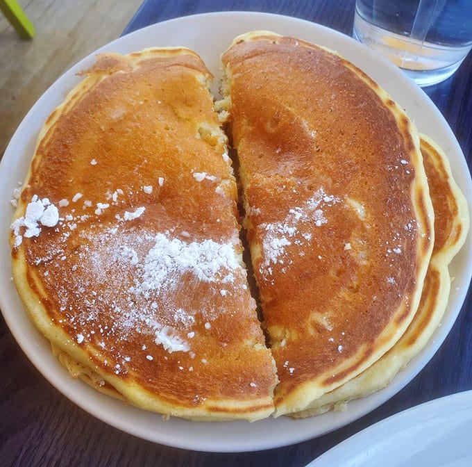 Golden pancakes that look like they've been practicing their tan lines&mdash;perfectly crisp edges giving way to cloud-like interiors that absorb syrup like a dream.