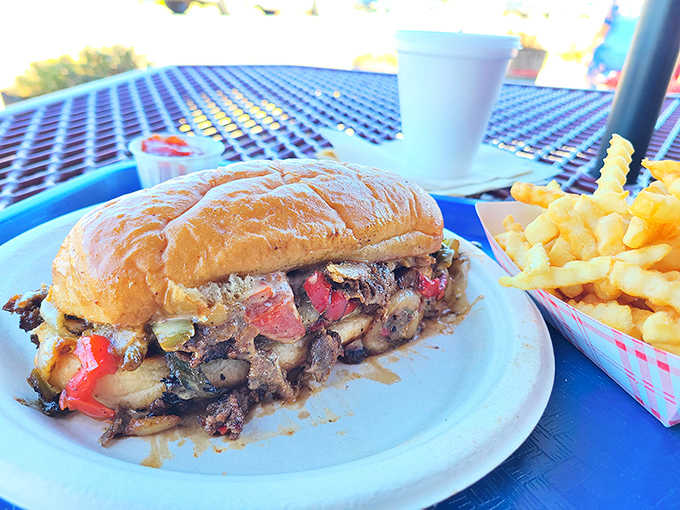 This isn't just a Philly cheesesteak; it's a masterclass in sandwich architecture where mushrooms, peppers, and beef create a beautiful chaos of flavors.