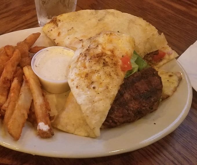 This isn't just a burger &ndash; it's an architectural masterpiece of beef, cheese, and fresh vegetables that demands to be photographed before devouring.