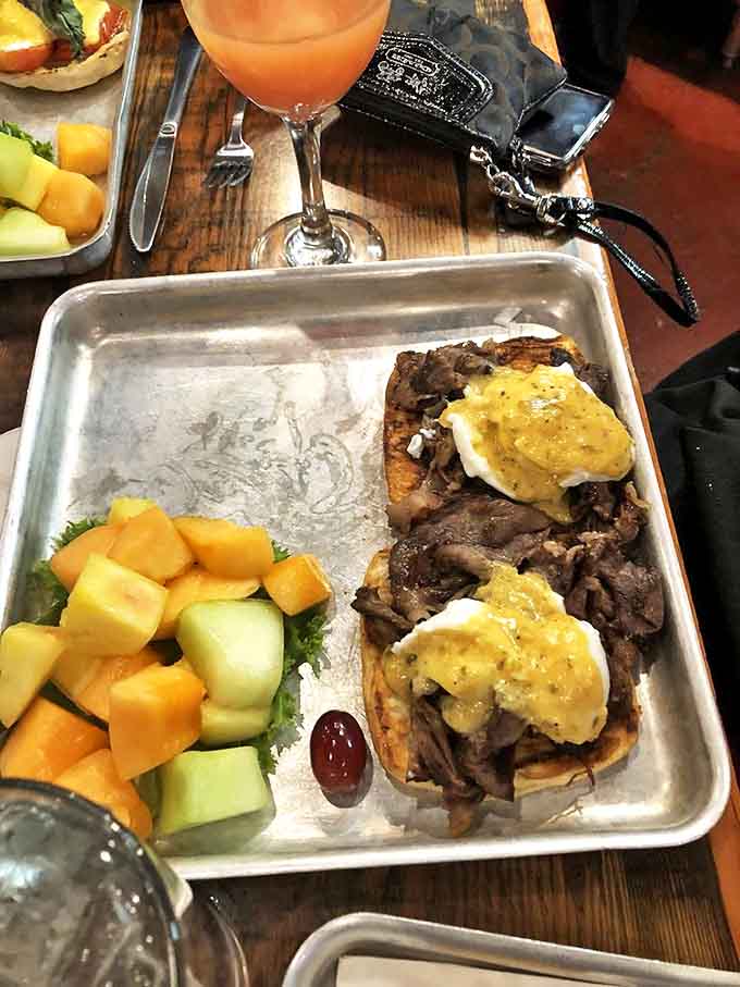 Prime rib so tender it practically surrenders to your fork, served alongside fresh fruit that brings a pop of color to your plate.