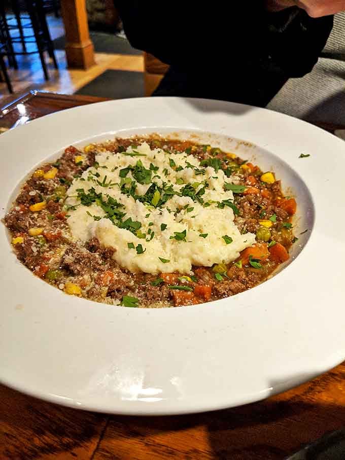 Behold the star attraction: shepherd's pie that would make even Frodo forget about the Ring. The perfectly browned potato peaks hide treasures below.