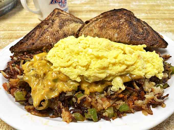 Breakfast architecture at its finest&mdash;crispy hash browns foundation, savory fillings, melty cheese, and eggs that make you question why you ever eat anything else.