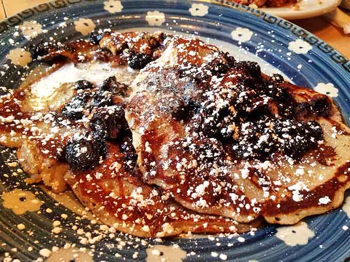 These blueberry pancakes aren't just breakfast, they're edible poetry&mdash;golden discs studded with bursts of berry goodness and dusted with powdered sugar snow.
