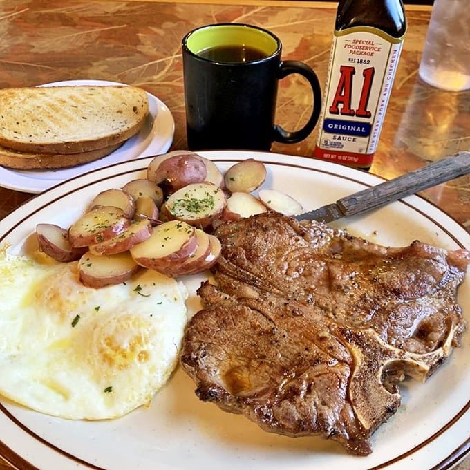 This isn't just steak and eggs—it's morning meditation on a plate. The perfectly cooked T-bone whispers, "Go ahead, cancel your lunch plans."