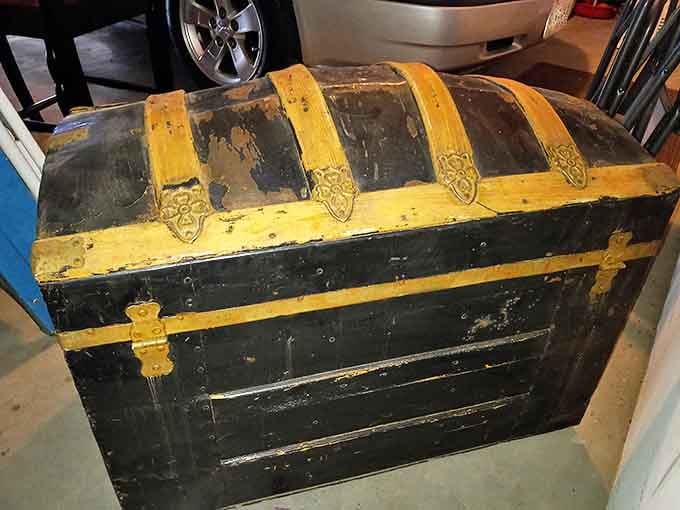 That's not just a trunk; it's a pirate's chest for grown-ups. Imagine the voyages this vintage beauty has seen before landing in Bakersfield.