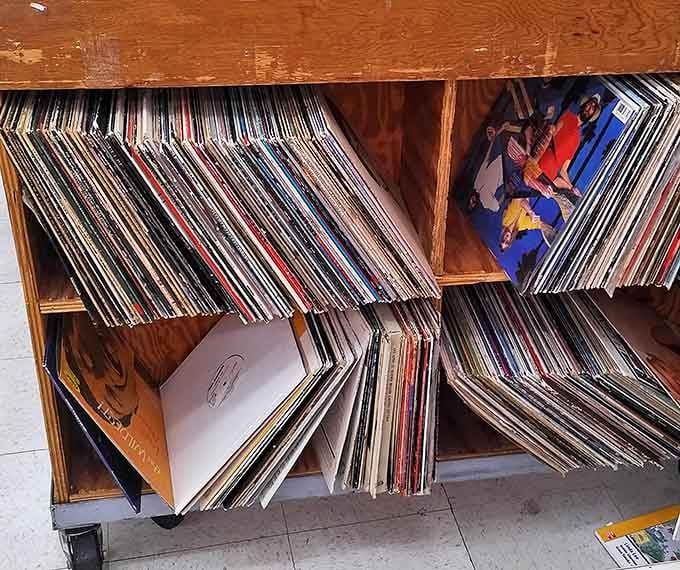 Vinyl enthusiasts, prepare to lose track of time! These wooden cubbies hold musical time capsules from decades past, each album cover a window to another era.