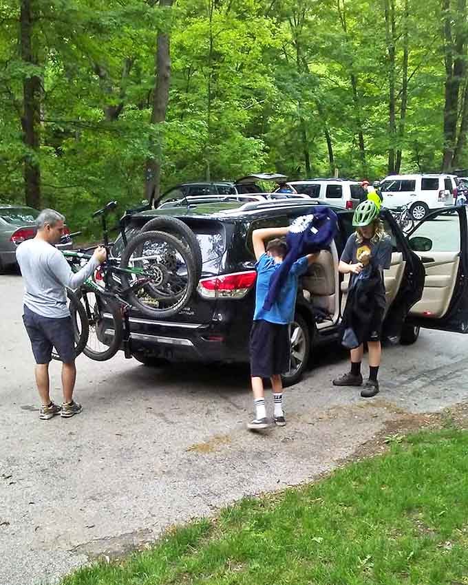 Family mountain biking adventures begin in the parking lot, where the real challenge is getting everyone geared up before someone changes their mind.