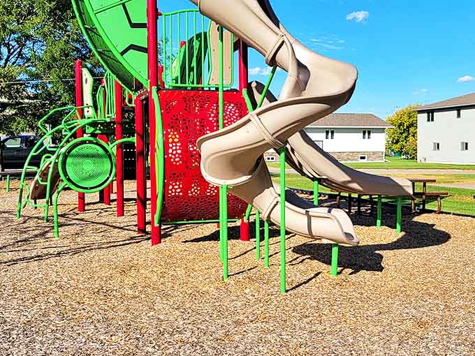 This colorful playground promises adventure for the little ones, while parents reminisce about simpler times when slides were the ultimate thrill ride.