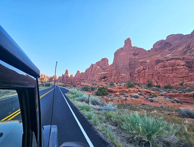The road dips and curves through Castle Valley like nature's own roller coaster, minus the overpriced souvenir photo.
