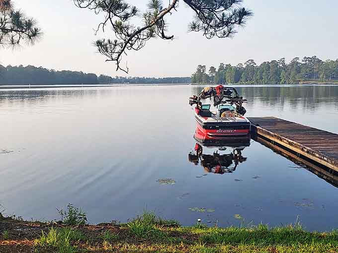 Dawn breaks over Geiger Lake as a fishing boat waits patiently for its captain. Some call it early; anglers call it prime time.
