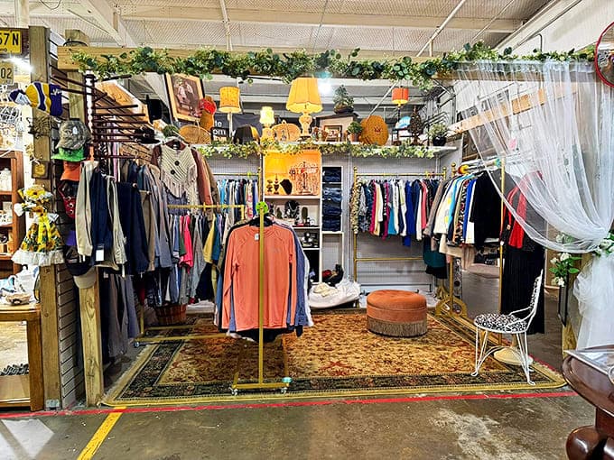 Vintage clothing displayed with the care of a high-end boutique. That orange footstool has probably heard stories from several decades.