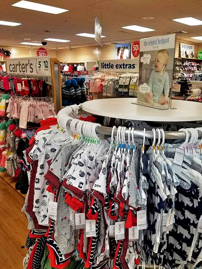 Carter's tiny clothes arranged with military precision&mdash;because dressing small humans requires both strategy and adorable patterns.