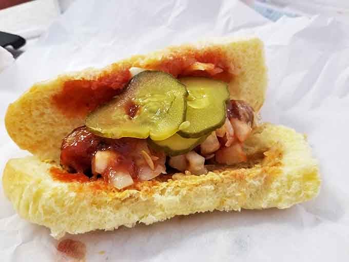 The bratwurst at Mickey-Lu's isn't just a sausage, it's Wisconsin's soul on a bun. Those charred edges and pickle slices are performing a flavor symphony.