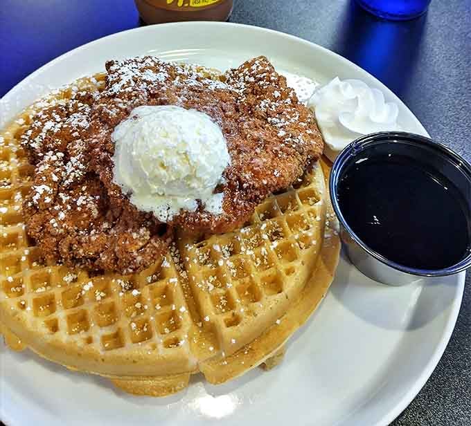 Chicken and waffles: where breakfast and dinner have a delicious identity crisis topped with a scoop of ice cream and zero regrets.