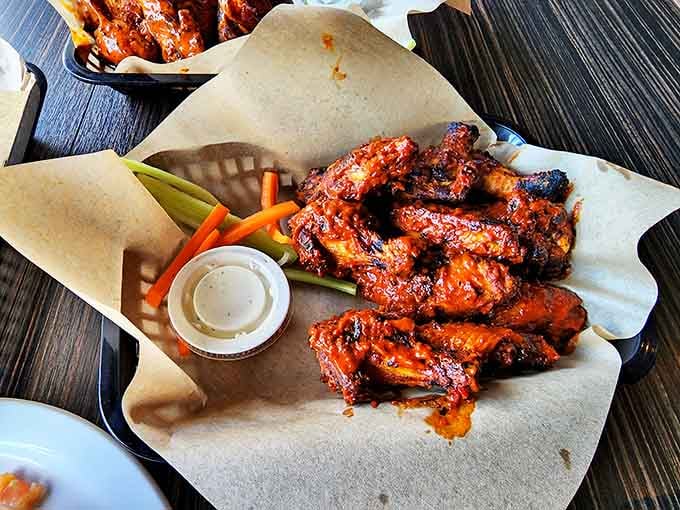 These wings aren't just cooked; they're transformed into crispy, sauce-lacquered masterpieces that make finger-licking not just acceptable, but mandatory.