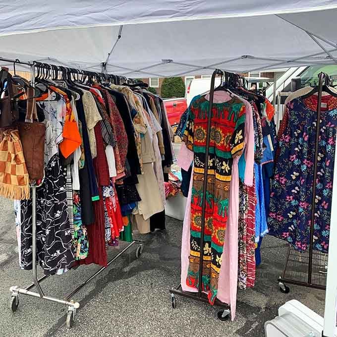 Vintage clothing racks burst with color and pattern&mdash;each garment a time machine waiting to transport you to another decade's style.