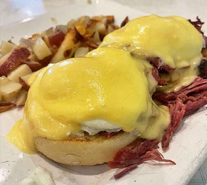 Eggs Benedict gets the corned beef treatment here, creating a savory masterpiece that would make even the most traditional brunch purist nod in approval.