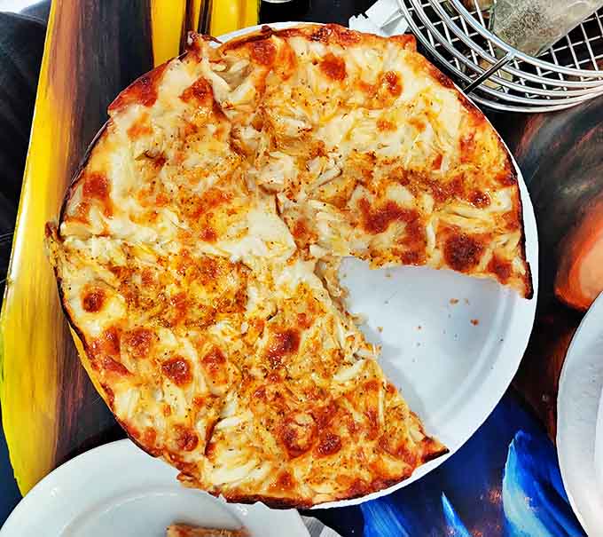 This crab pizza isn't just a meal, it's a Maryland manifesto &ndash; golden cheese, sweet lumps of crab, and a crust that deserves its own zip code.